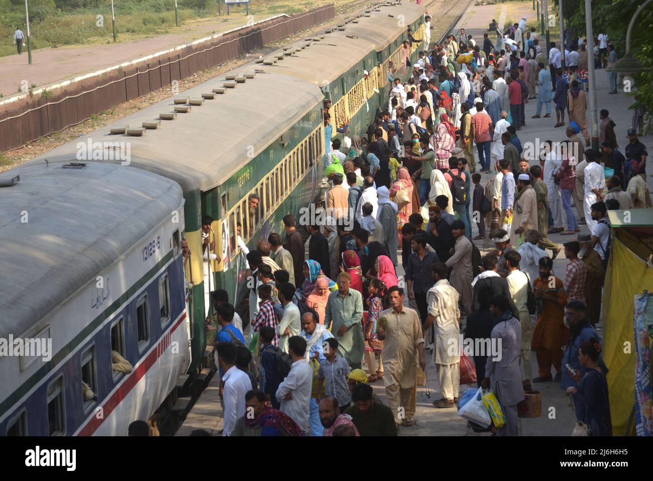 April 30, 2022, Lahore, Punjab, Pakistan: Pakistani people ride on a ...