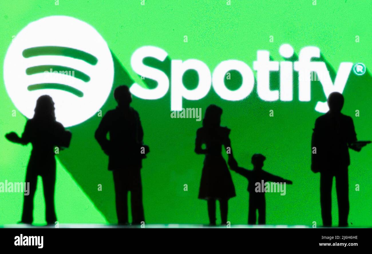 In this photo illustration, Miniature figures stand in front of a ...