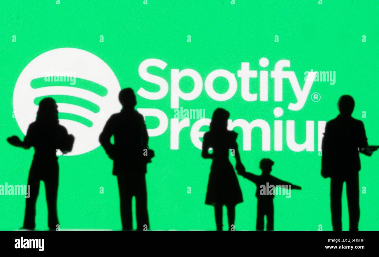 In this photo illustration, Miniature figures stand in front of a ...