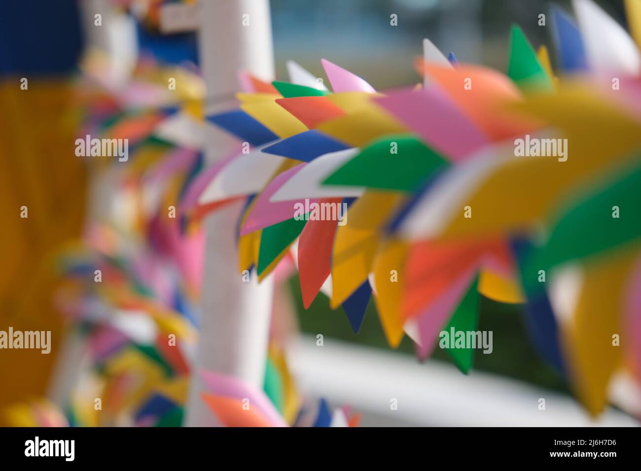 A rows of colorful origami paper propellers Stock Photo - Alamy