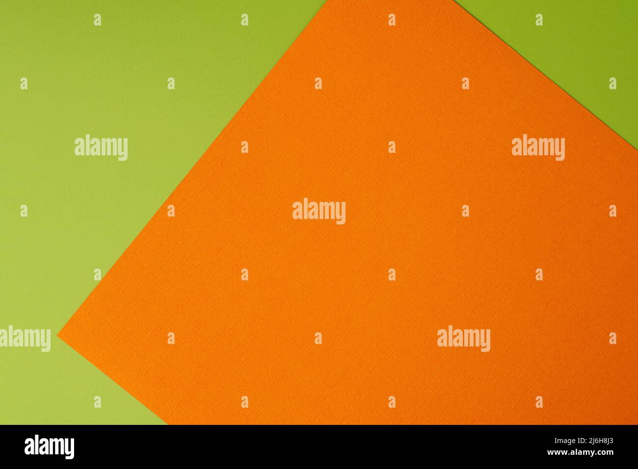 Orange and green colored background of layered cardboard sheets, top ...