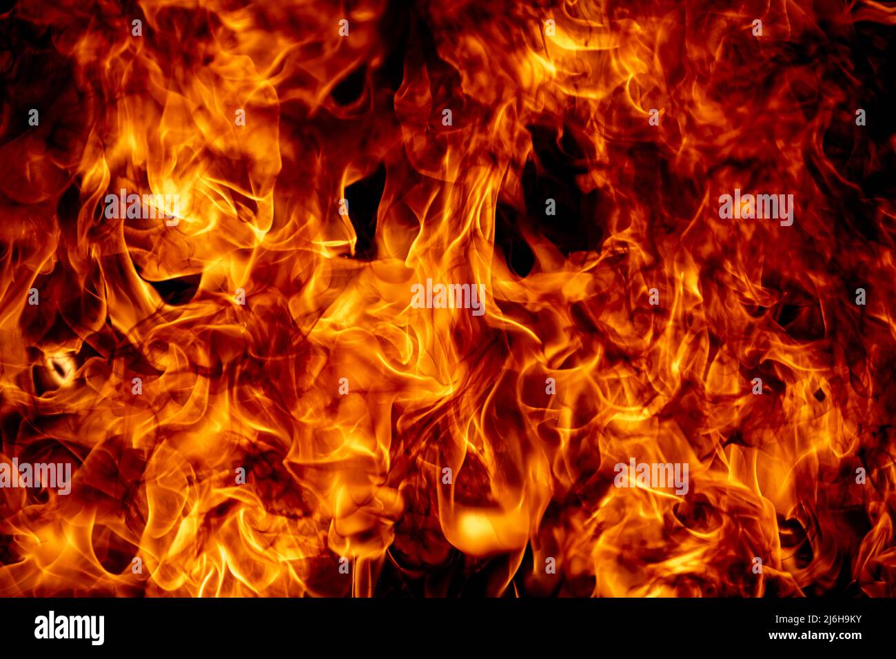 Texture of fire on a black background. Abstract fire flame background ...