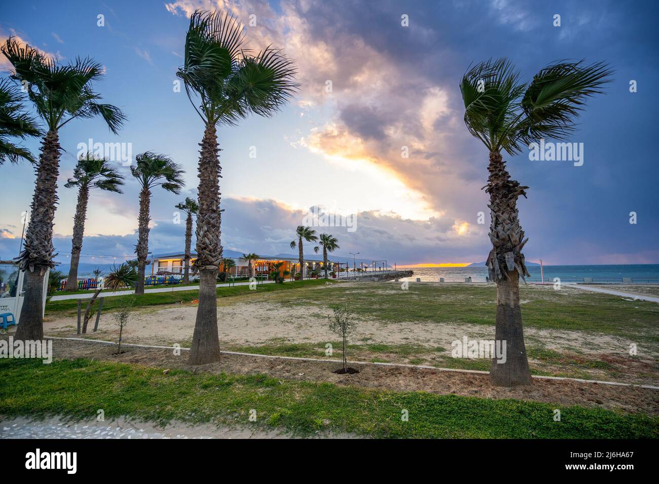 cafe by the sea. restaurant on the beach at sunset Stock Photo - Alamy