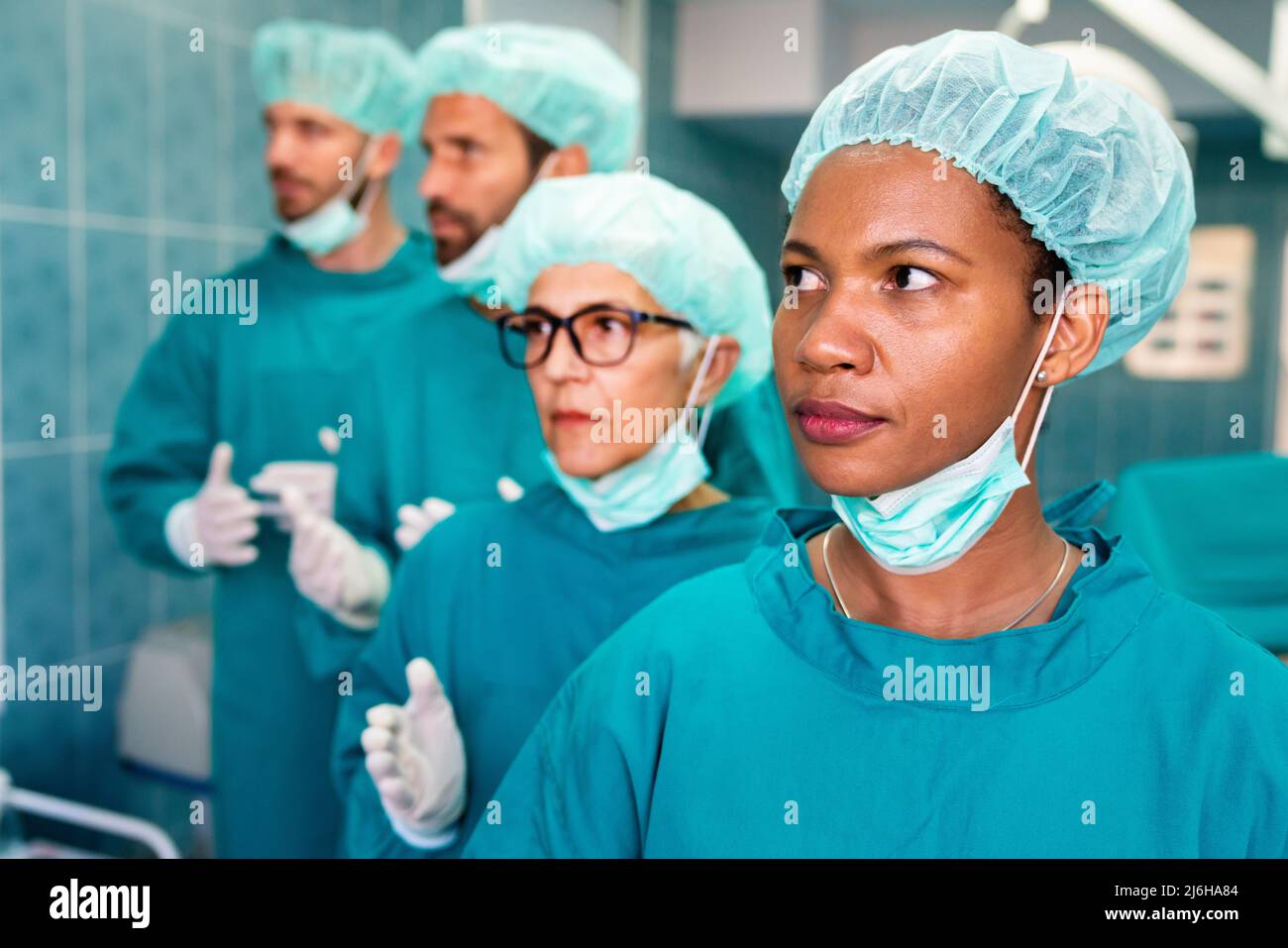 Portrait of successful team of surgeon standing in operating room ...