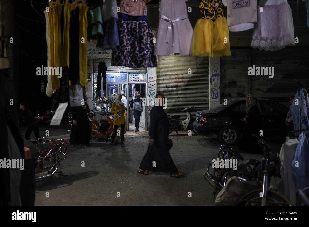 01 May 2022, Syria, Idlib: Syrian people shop at a local market in the ...