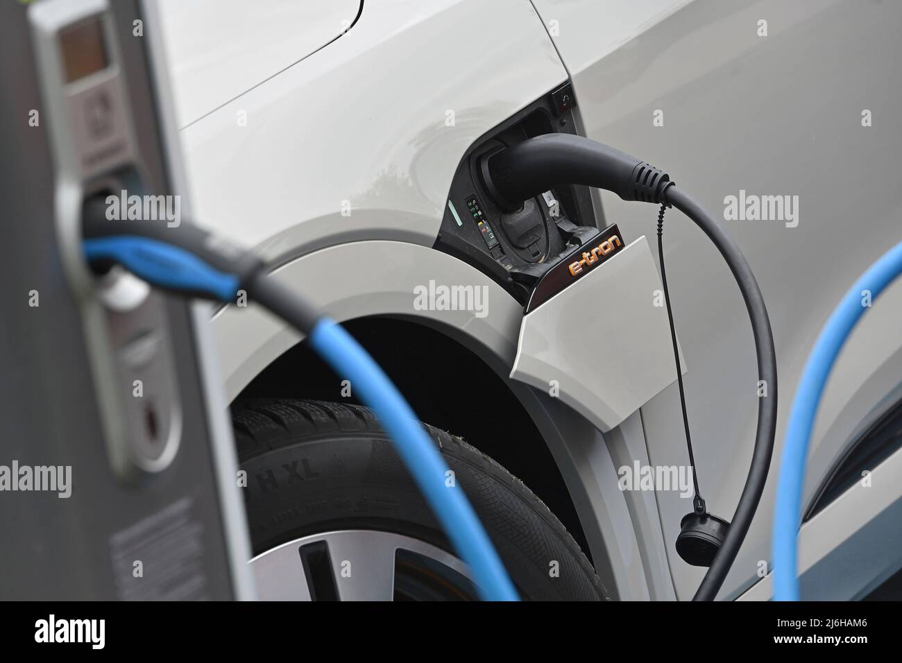E-car is loaded, plug during the charging process on an e-car, electric ...