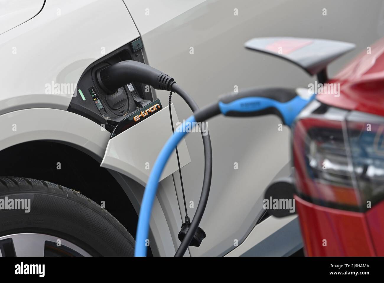 E-car is loaded, plug during the charging process on an e-car, electric ...
