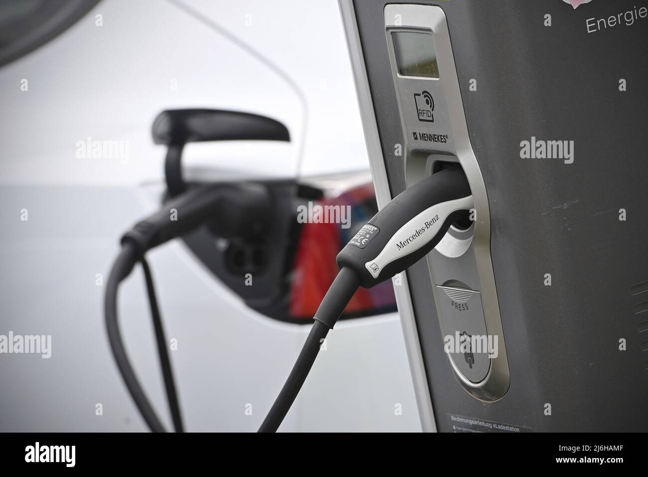 E-car is loaded, plug during the charging process on an e-car, electric ...