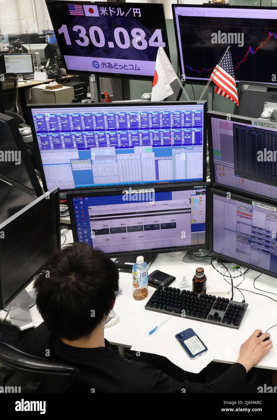 May 2, 2022, Tokyo, Japan - A money dealer trades under foreign ...