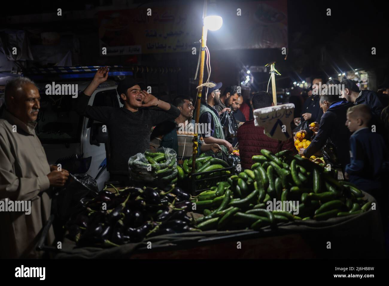 01 May 2022, Syria, Idlib: A Syrian vendor sells vegetables at a local ...