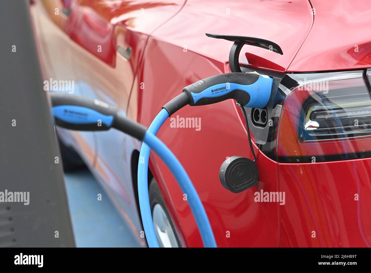 E-car is loaded, plug during the charging process on an e-car, electric ...