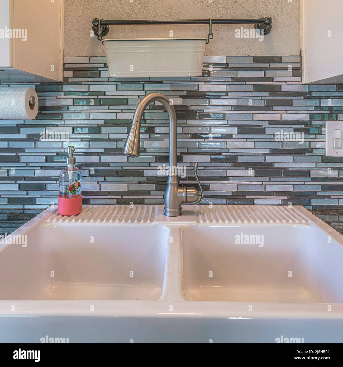 Square Ceramic double sink with single handle faucet in a kitchen Stock ...