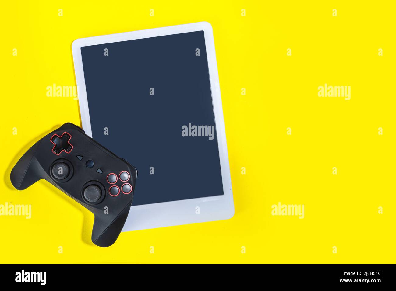 Mobile gaming concept with mobile gamers devices on bright yellow ...