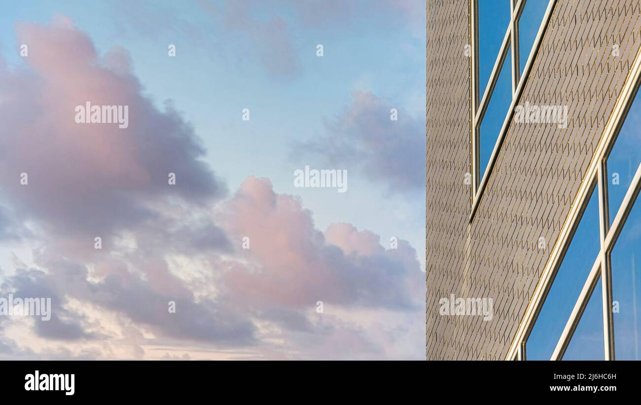 Panorama Puffy clouds at sunset Building structure with brown bricks ...