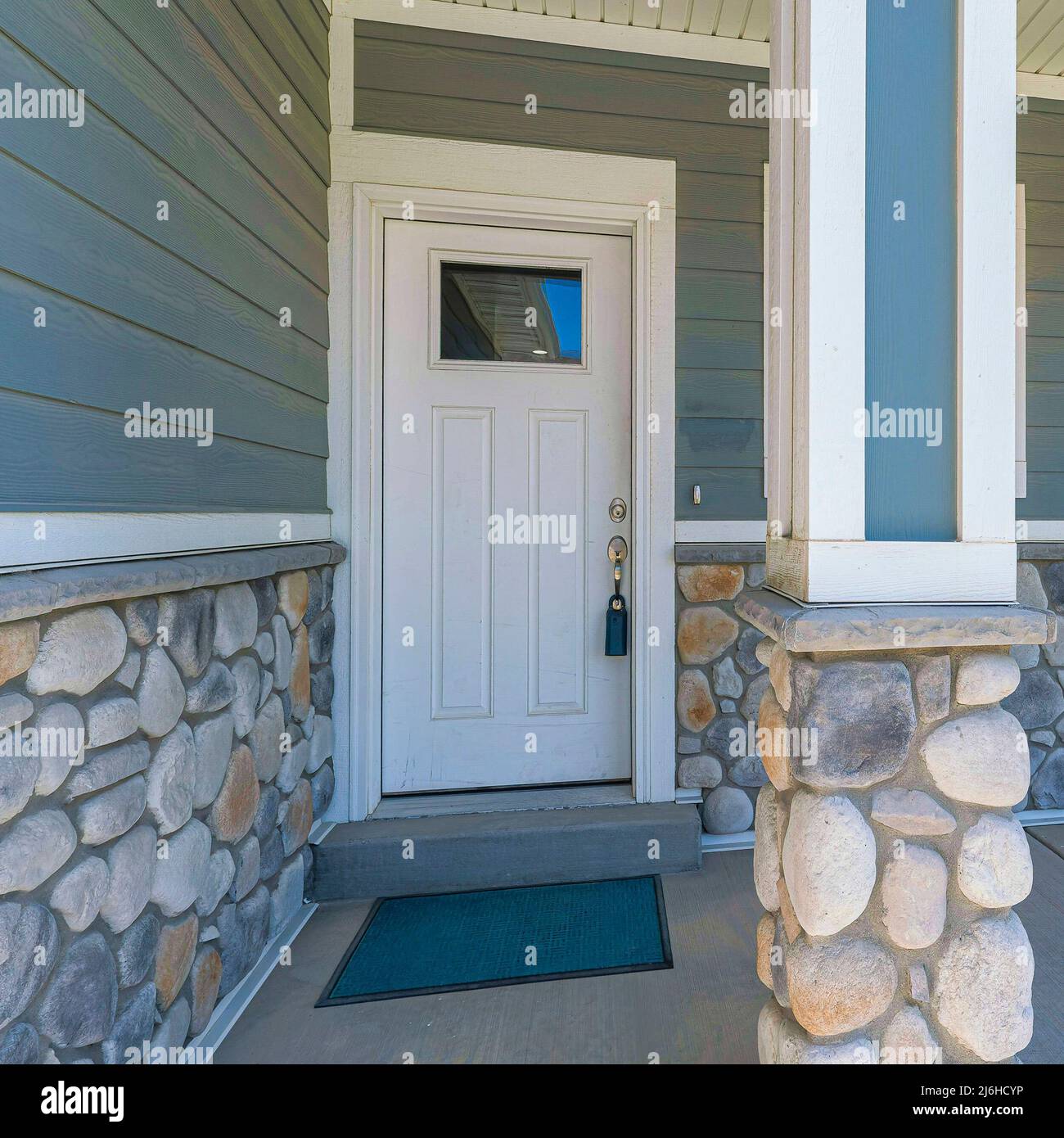 Square White front door of a house with glass panel and lockbox Stock ...