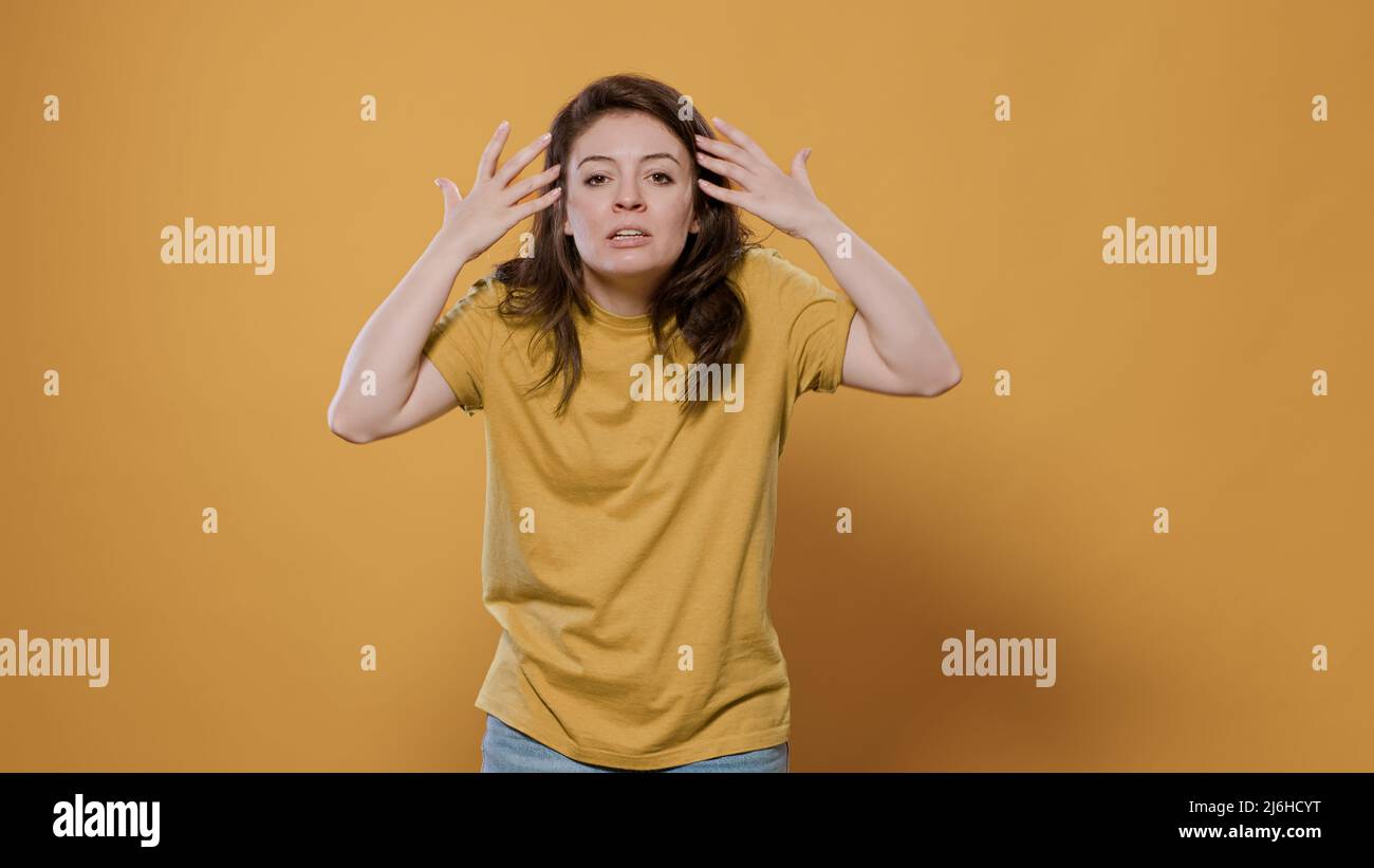 Nervous woman having a breakdown arguing moving hands and shouting ...