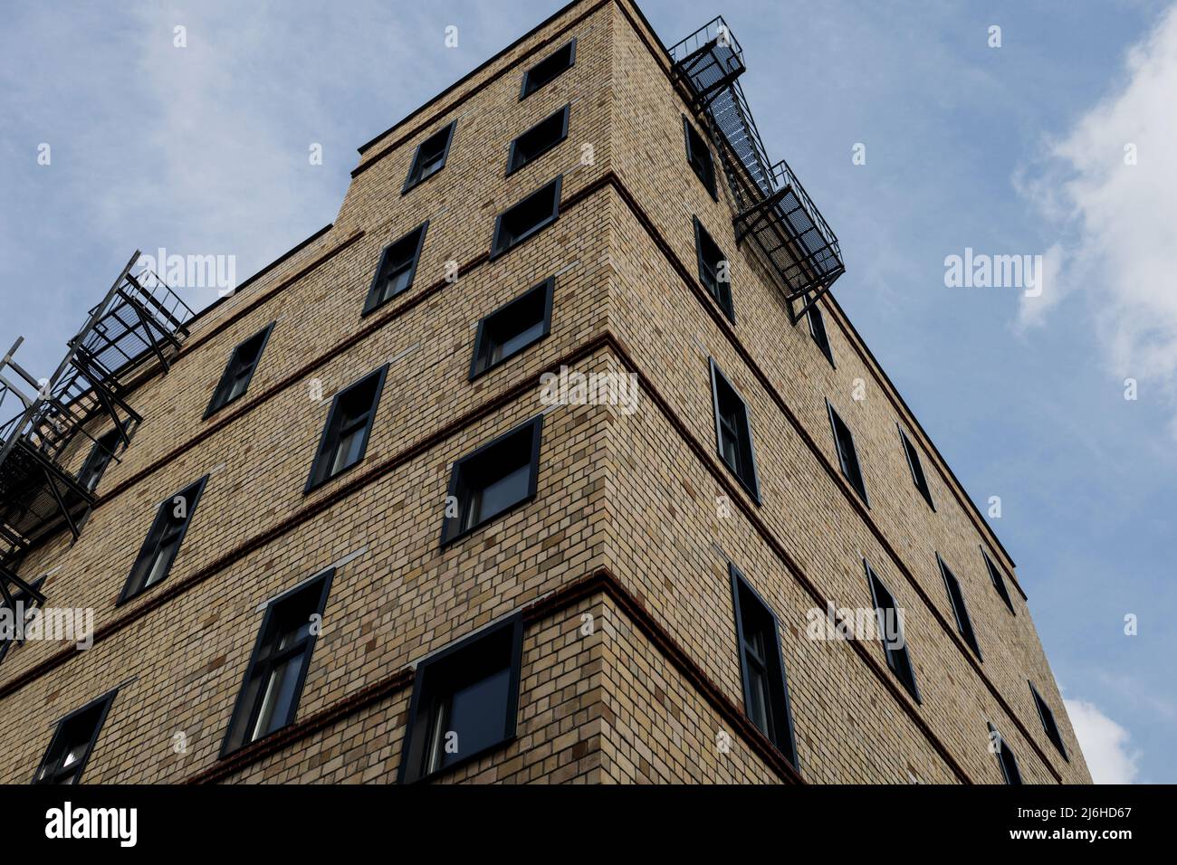 Brick wall architecture and blue sky. new modern european building ...