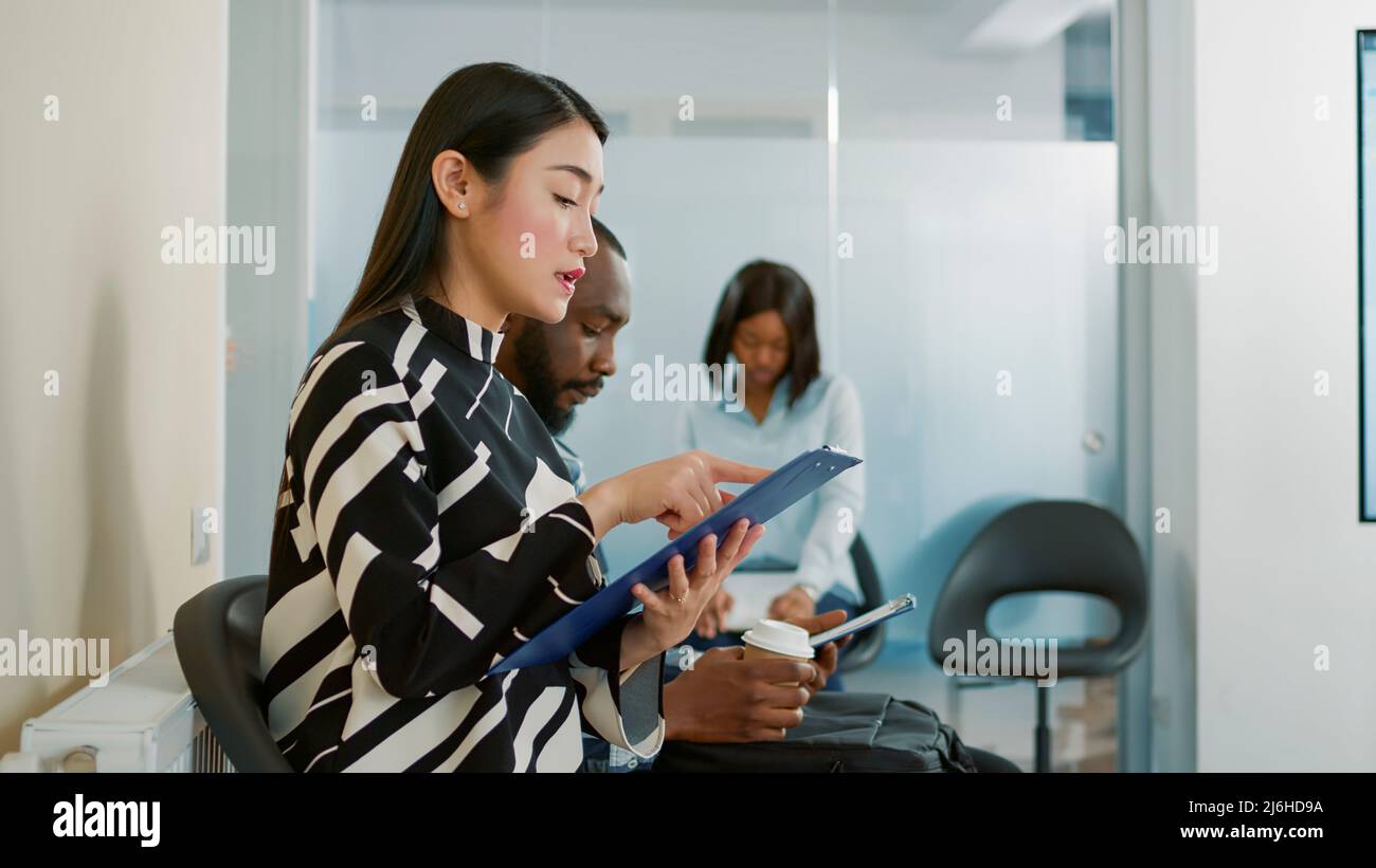 Asian woman looking cv resume hi-res stock photography and images - Alamy