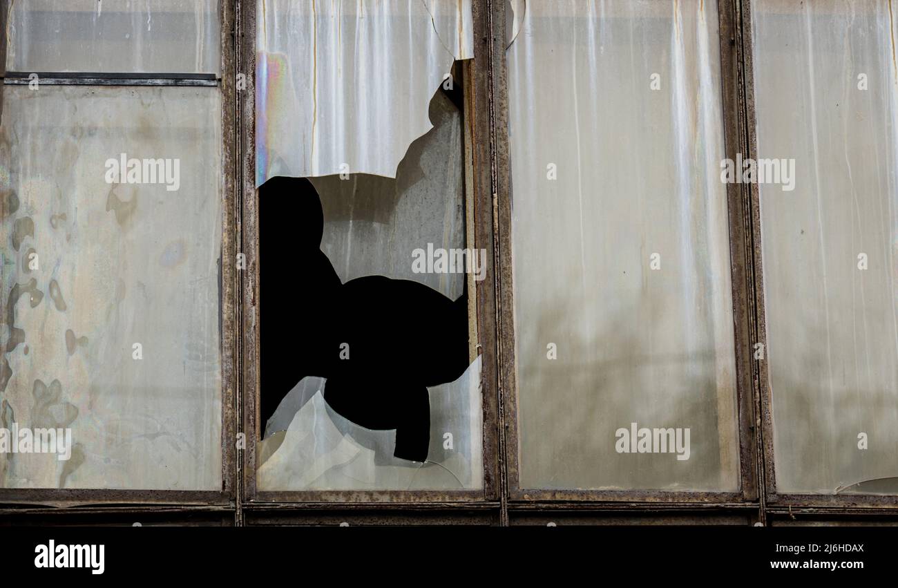 smashed window. Broken glass in a wooden window frame Stock Photo - Alamy