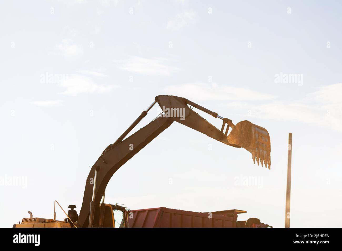 Excavator with blue sky. Excavators are heavy construction equipment ...