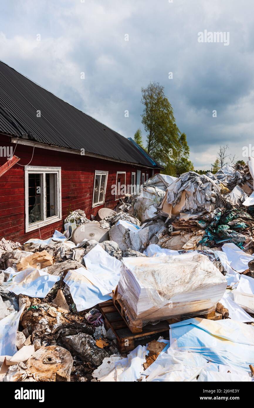 Litter in front of red building Stock Photo - Alamy