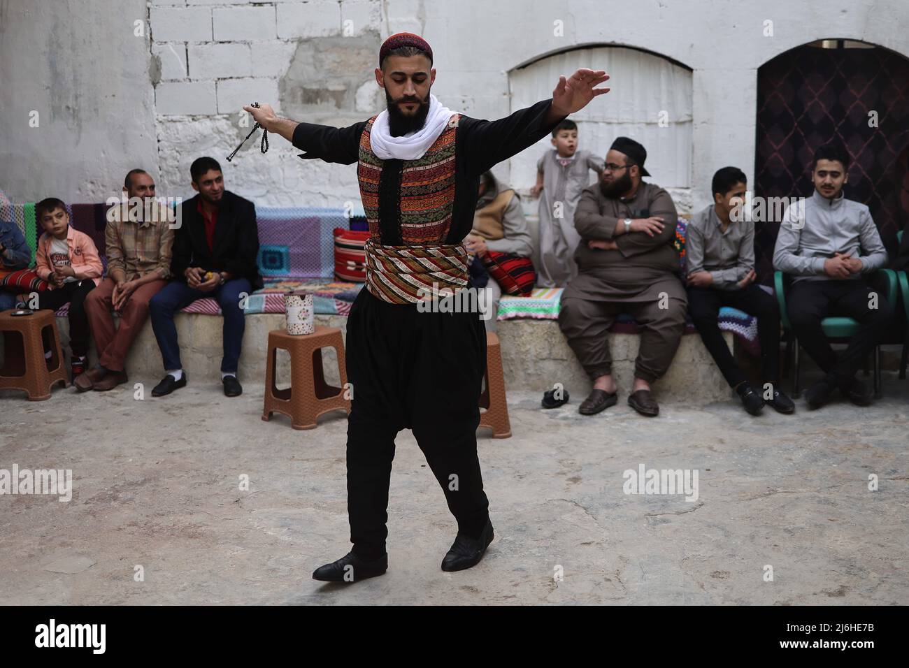 02 May 2022, Syria, Idlib: A Syrian man performs a traditional dance as ...