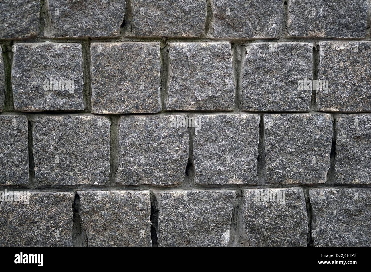 Gray stone wall. Square bricks fence. Abstract pattern of stone mosaic. Taupe Stone wall ...
