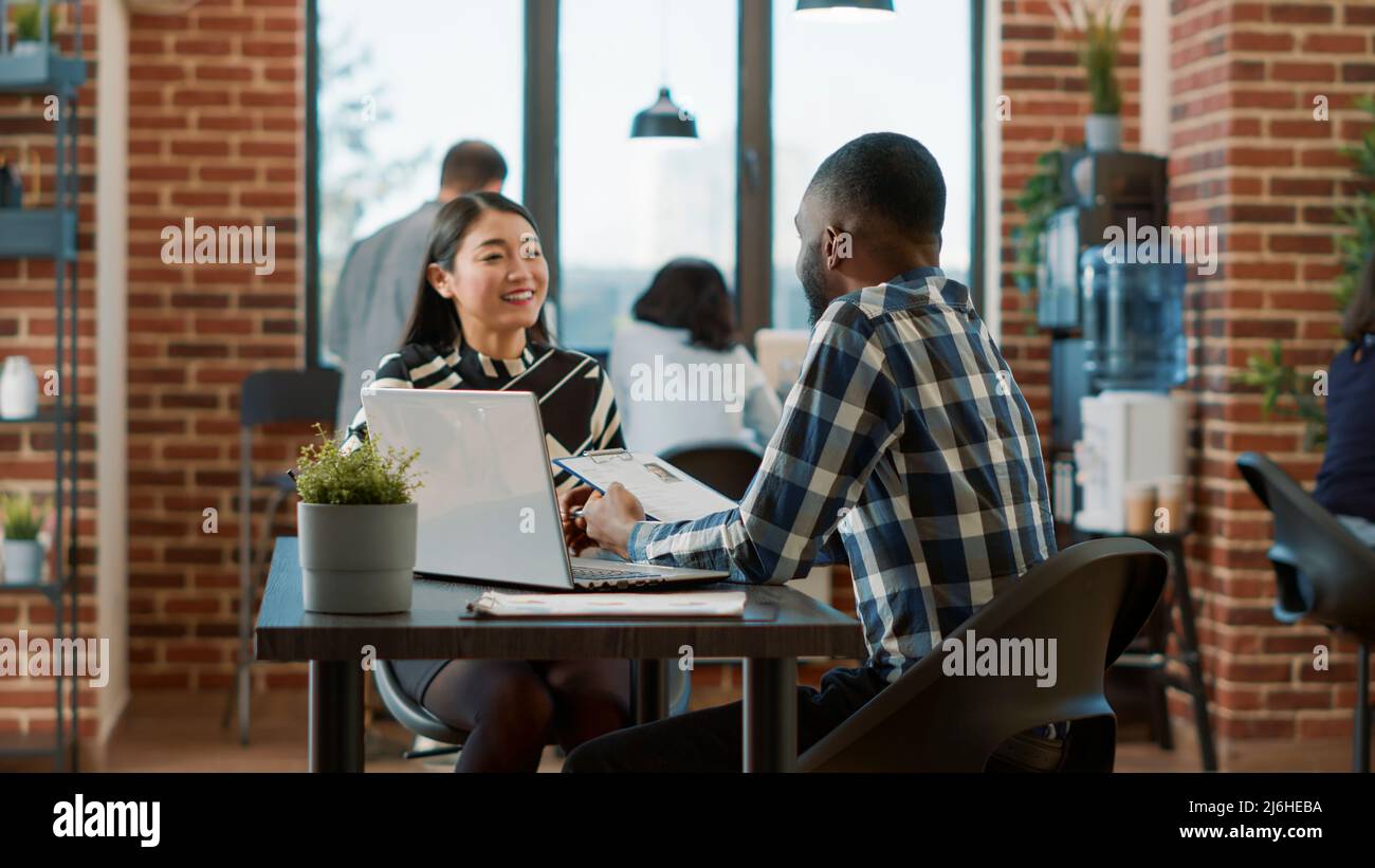 African american recruiter greeting asian woman at job interview ...