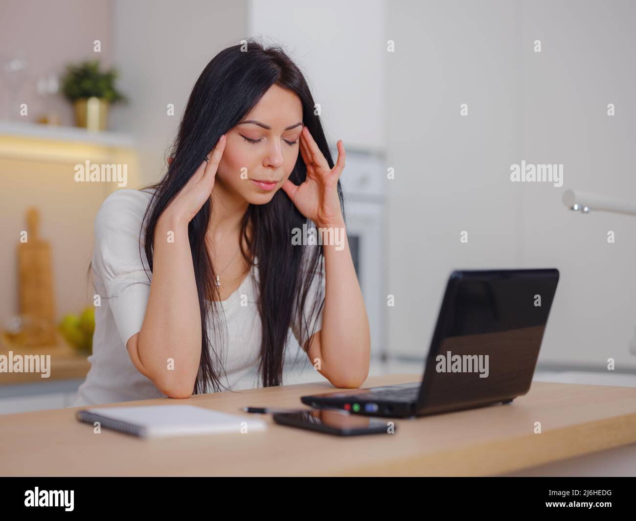 Stressed overworked business woman working from home , feel eye strain ...