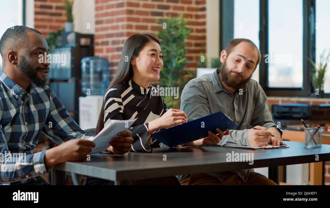 Multiethnic group of recruiters interviewing confident woman, analyzing ...