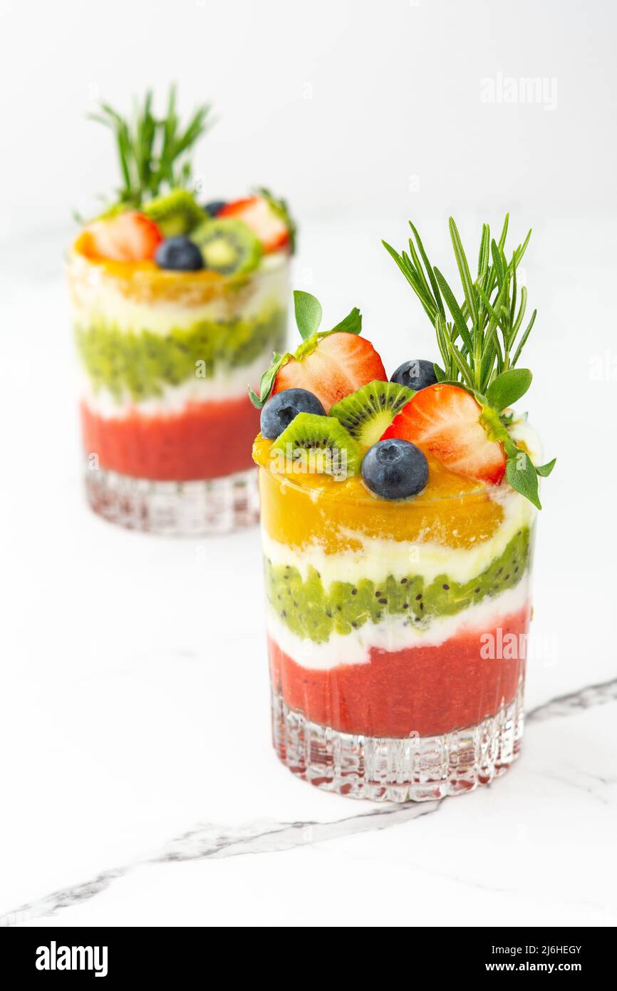 Strawberry, kiwi and mango smoothies with natural yogurt in glasses ...
