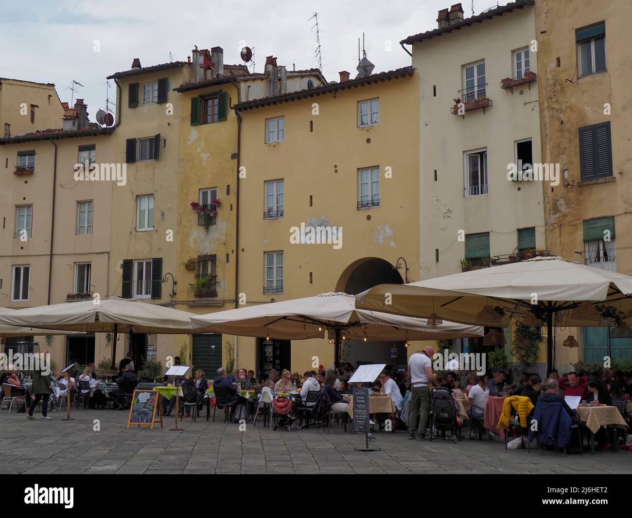 people dining at restaurants in the old roman amphitheatre,Piazza dell ...