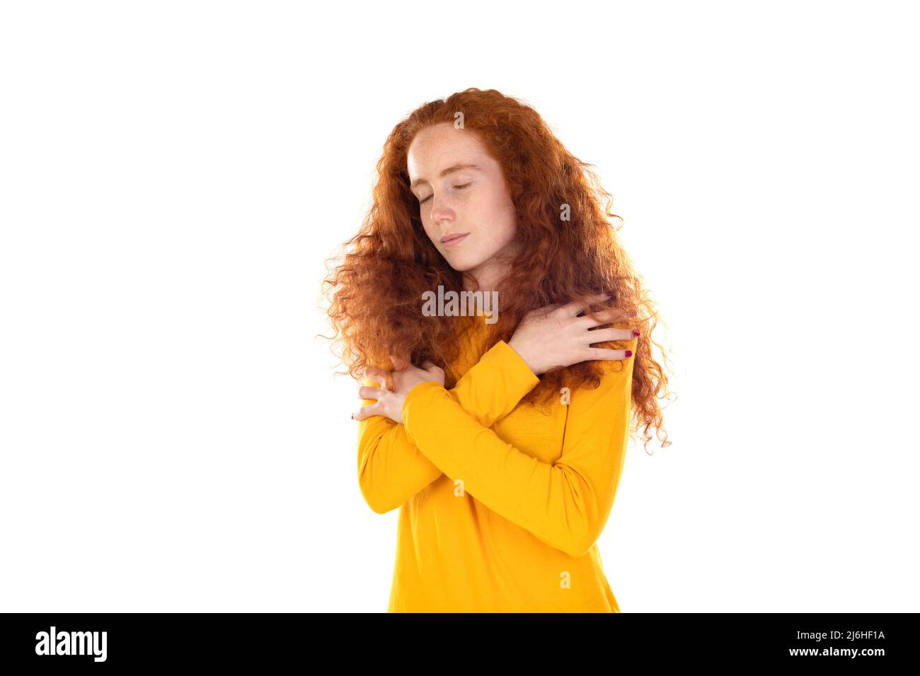 Sad red-haired girl isolated on a white background Stock Photo - Alamy