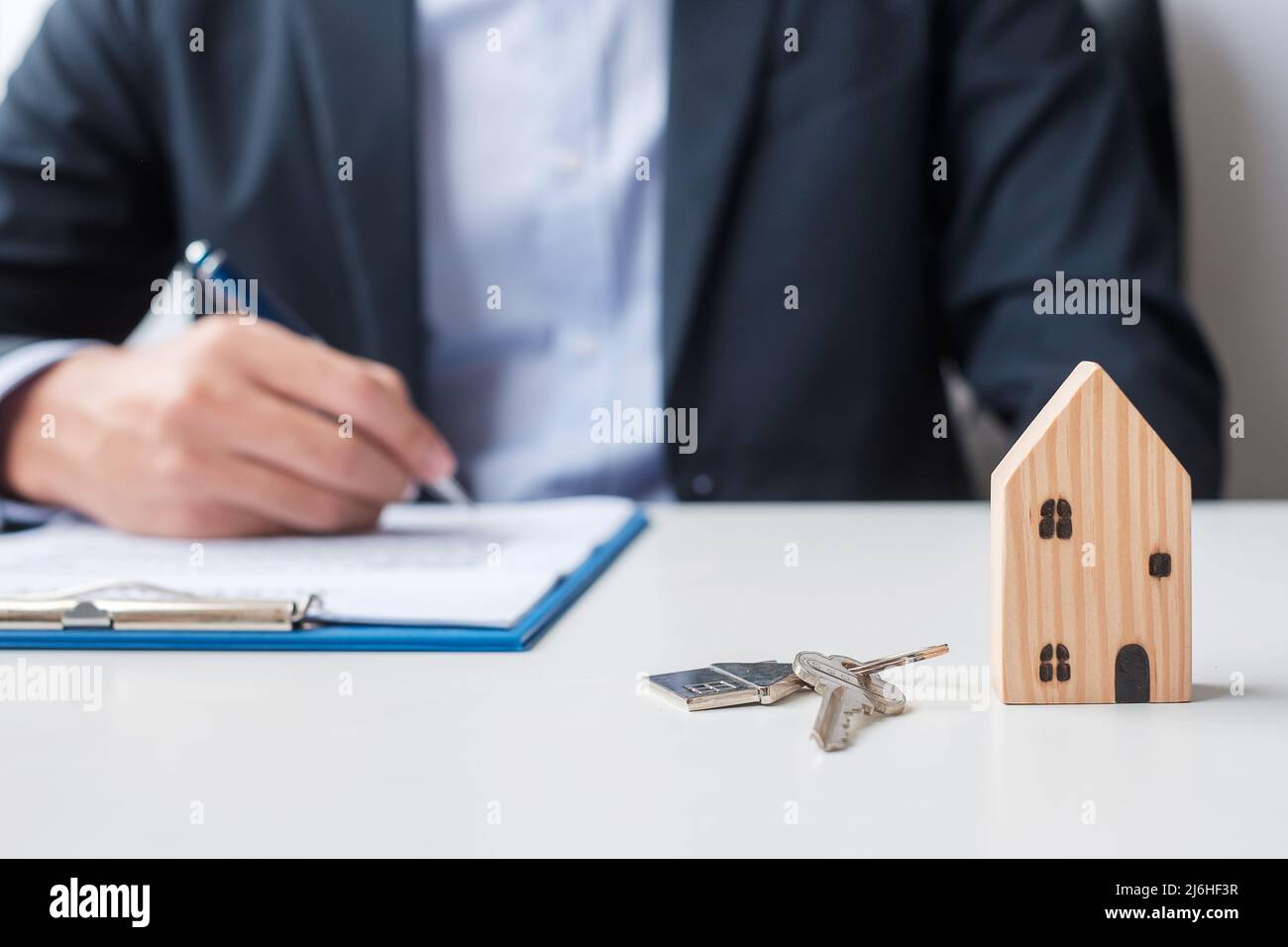 man signing home contract documents. Contract agreement, real estate ...