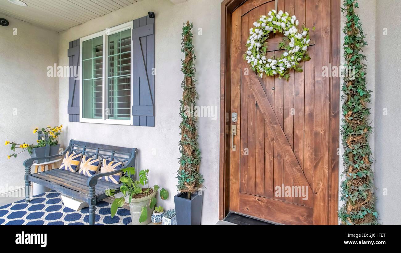Panorama Porch of a house with wooden front door with digital key ...
