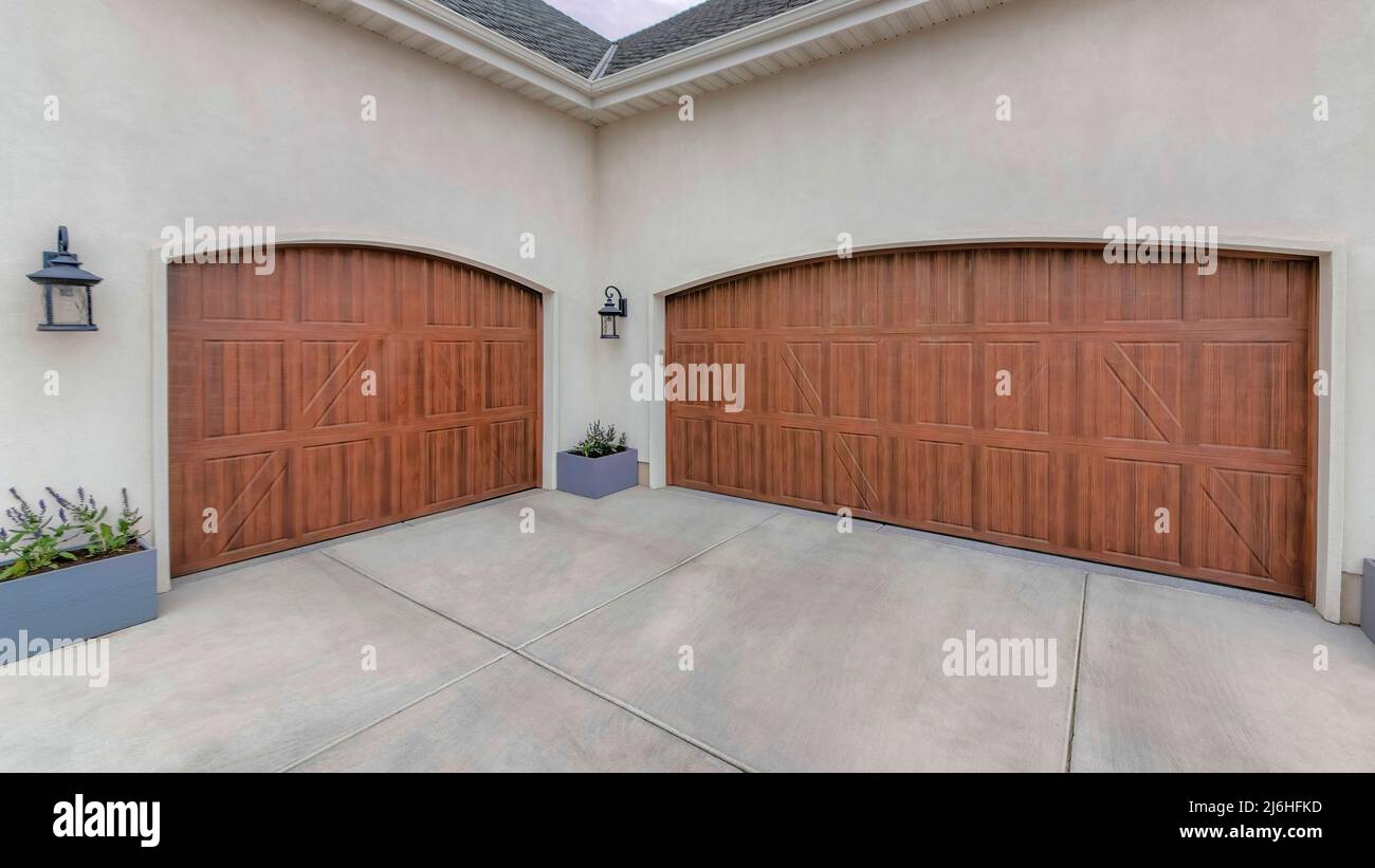 Panorama Puffy clouds at sunset Decorated three-car garage exterior ...