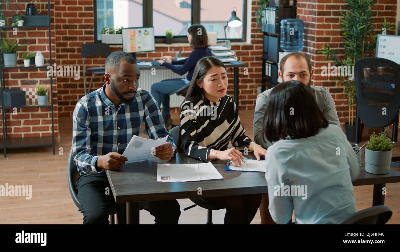 Displeased worker getting fired multiethnic hi-res stock photography ...