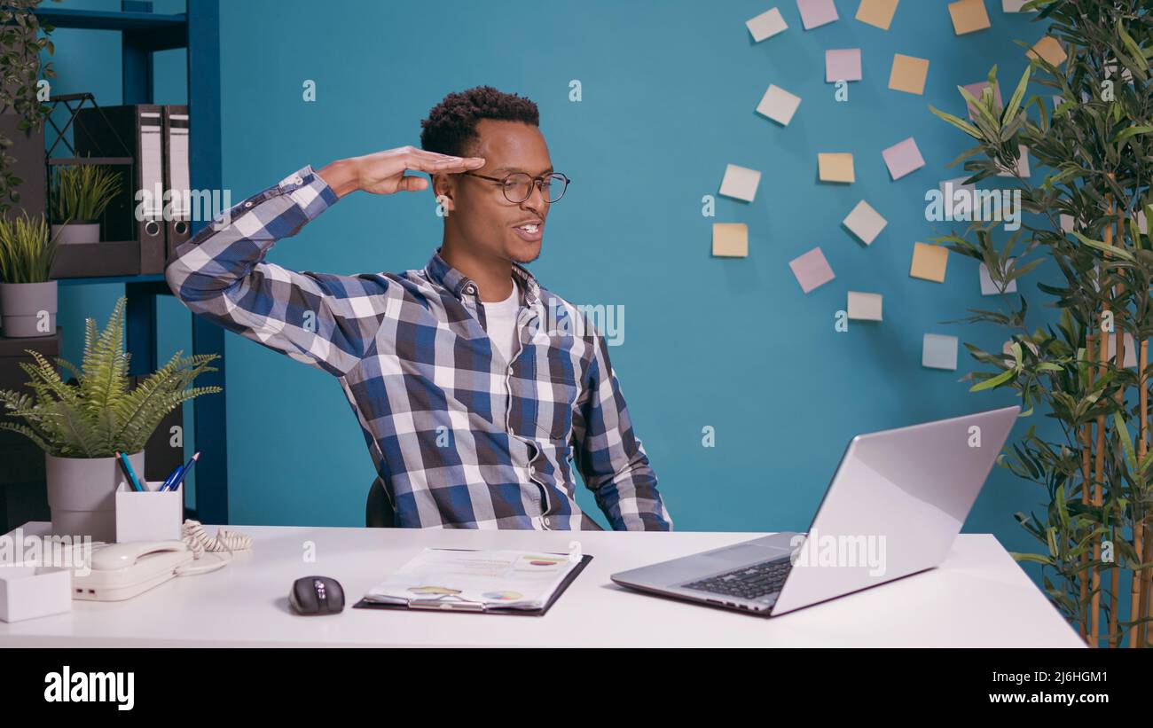 Office worker doing military salute to show respect and patriotism ...