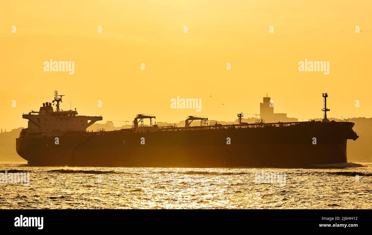 An old bulk carrier or bulker sails in the sea to trade around the ...