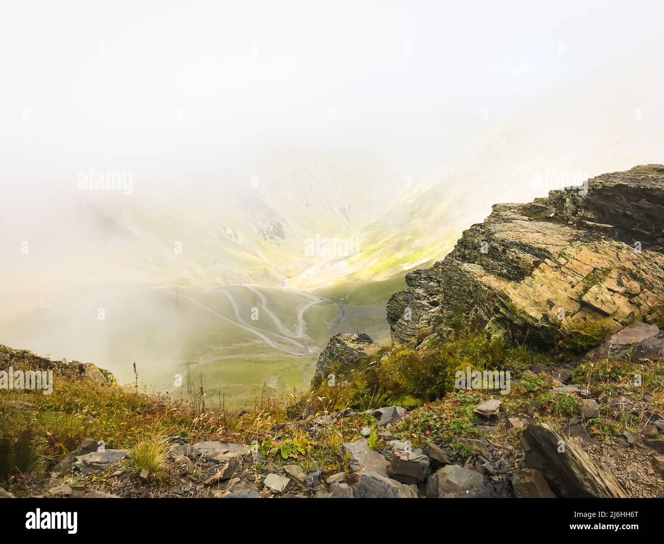 Cinematic stunning Tusheti road panorama with mist and green landscape ...