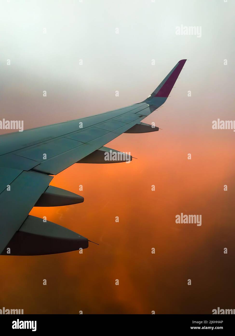 Hazy airplane wing view sunny cinematic panorama during flight over ...