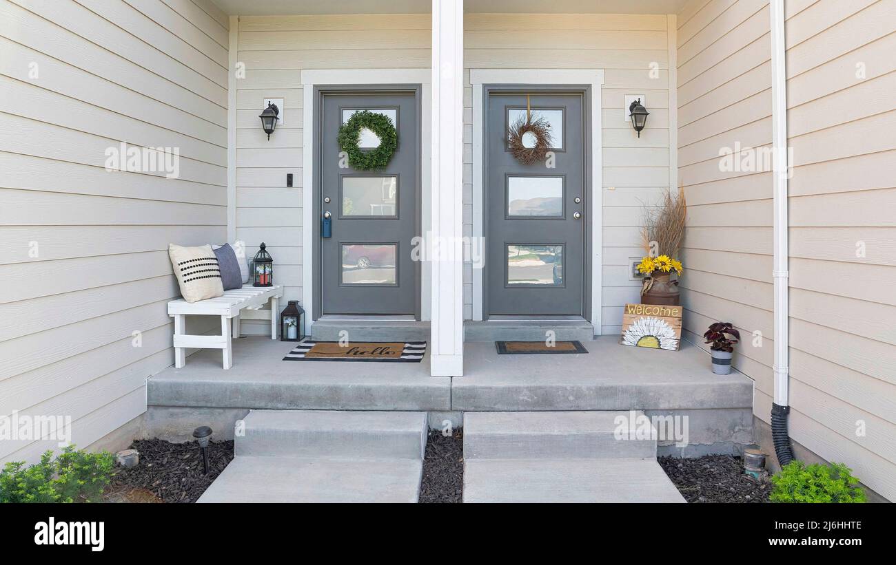 Panorama Two gray front door of a townhouse with two concrete entrance ...