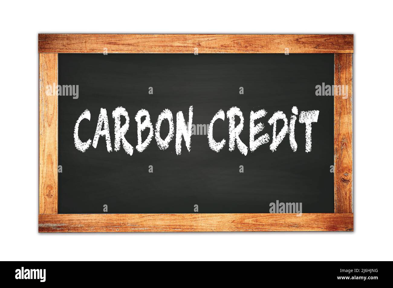 CARBON CREDIT text written on black wooden frame school blackboard ...