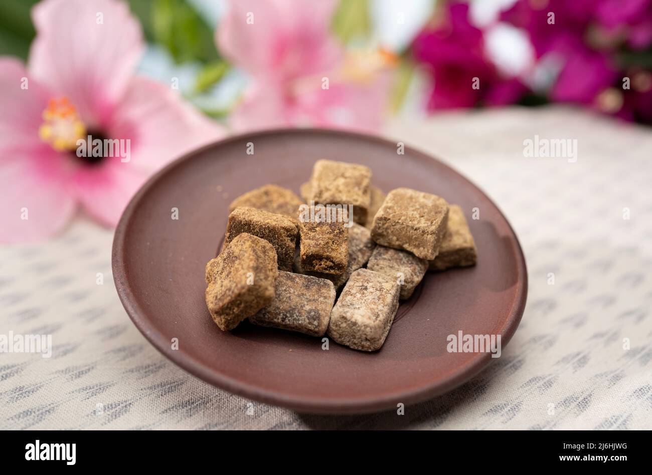A selection of brown sugar ( kokutou ) from different Okinawan islands ...