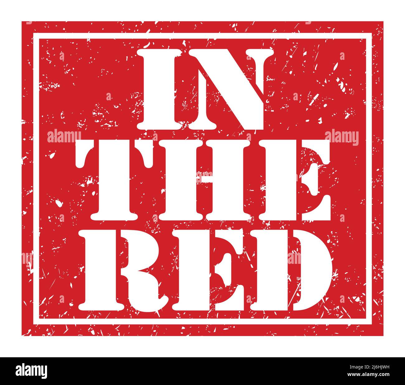 IN THE RED, words written on red stamp sign Stock Photo - Alamy