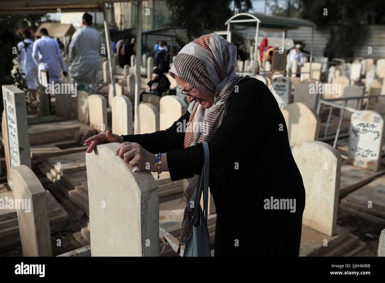 02 May 2022, Iraq, Baghdad: An Iraqi woman cries as she visits the ...