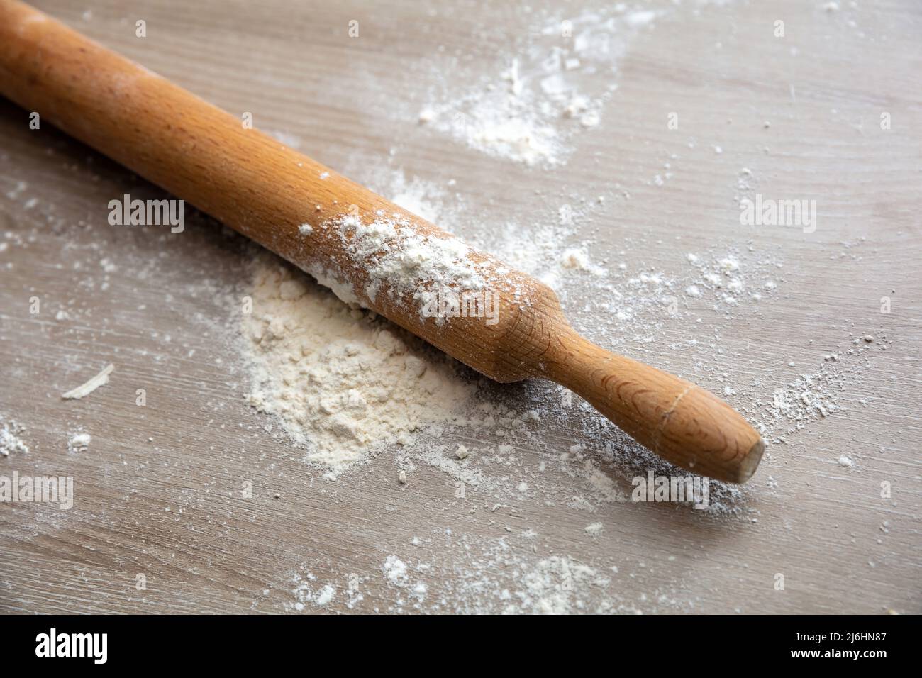 Rolling pin, wooden dough roller and flour on wood, Homemade dough and ...