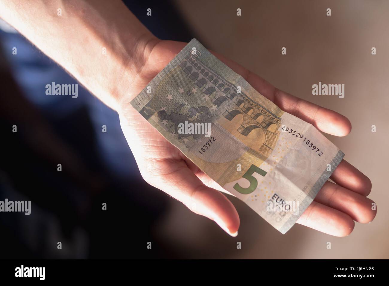 5 Euro Banknote In Hand Stock Photo - Alamy