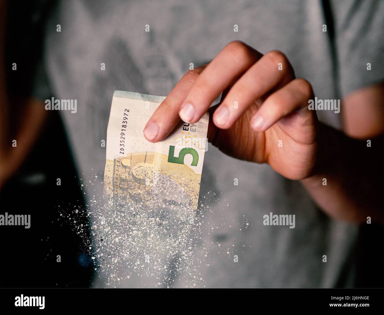 5 Euro Banknote Disintegrates To Paper Dust In Hand Stock Photo - Alamy