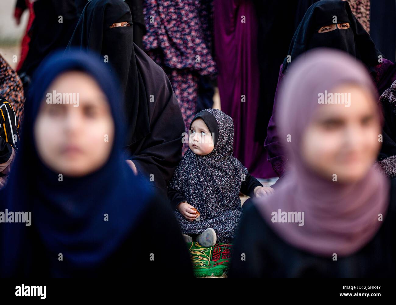 Palestinian Muslims attend Eid al-Fitr prayers at sunrise marking the ...